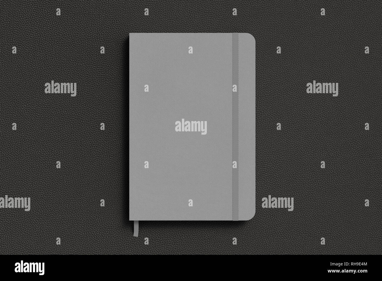 Gray vertical notebook with elastic band on black background Stock ...