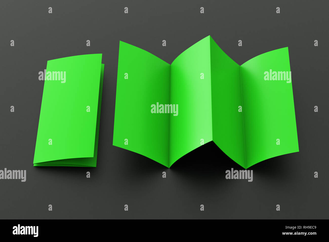 Blank green folded paper leaflet on black background. Eight pages, four ...