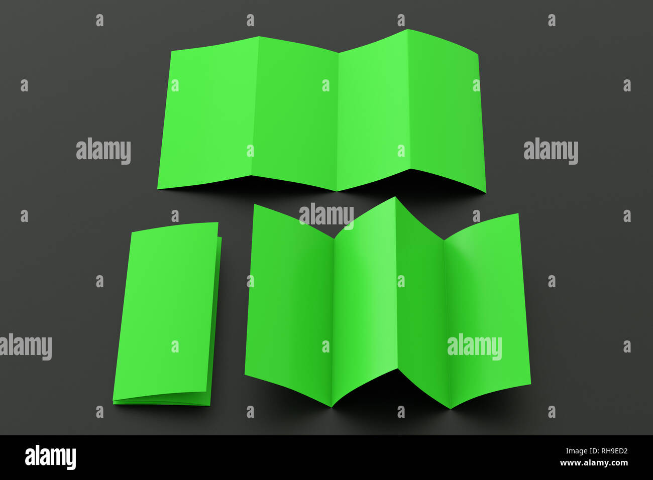 Blank green folded paper leaflet on black background. Eight pages, four ...
