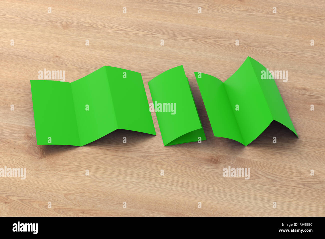 Blank green trifold paper leaflet on wooden background. Six pages ...
