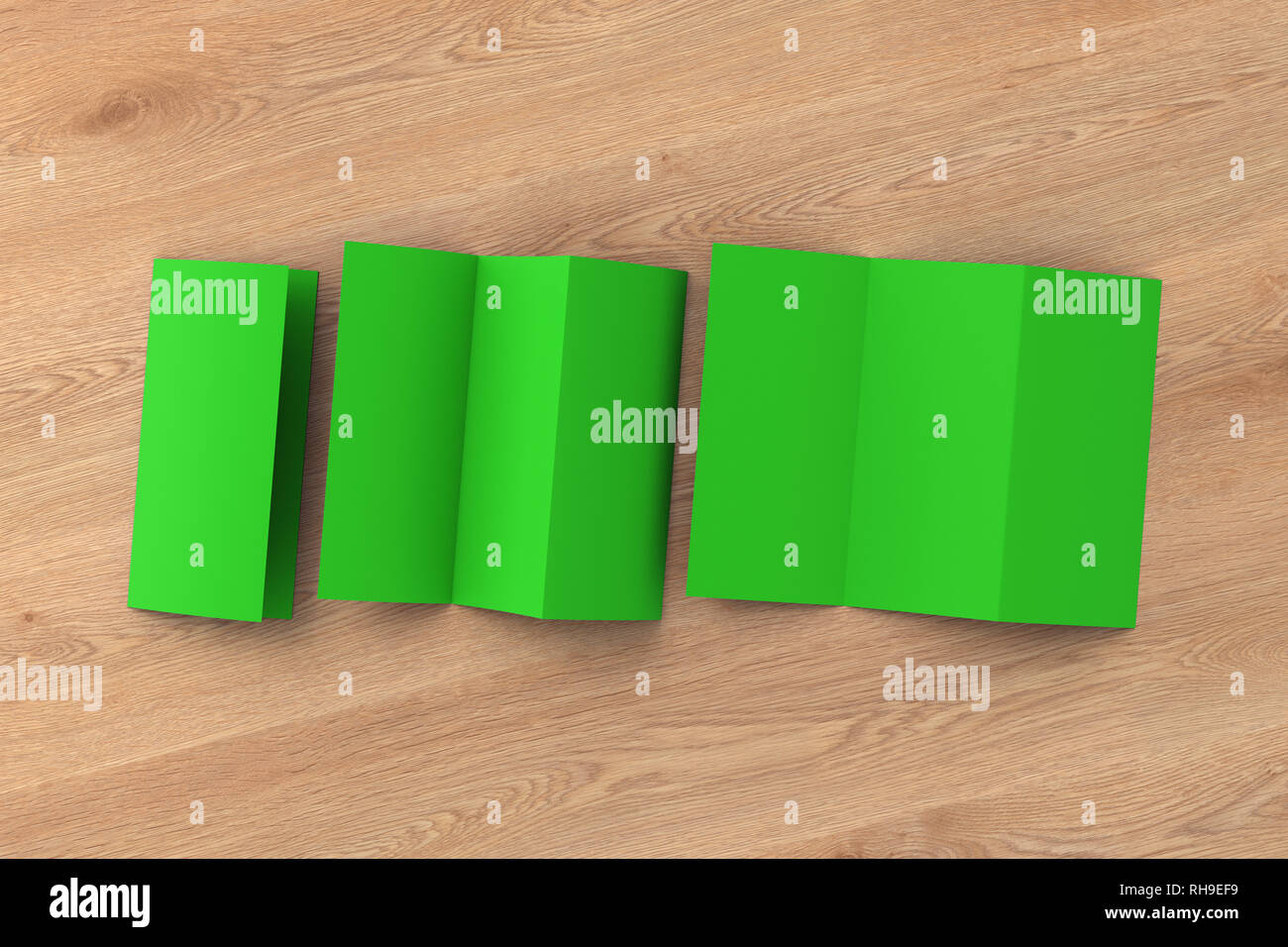 Blank green trifold paper leaflet on wooden background. Six pages ...