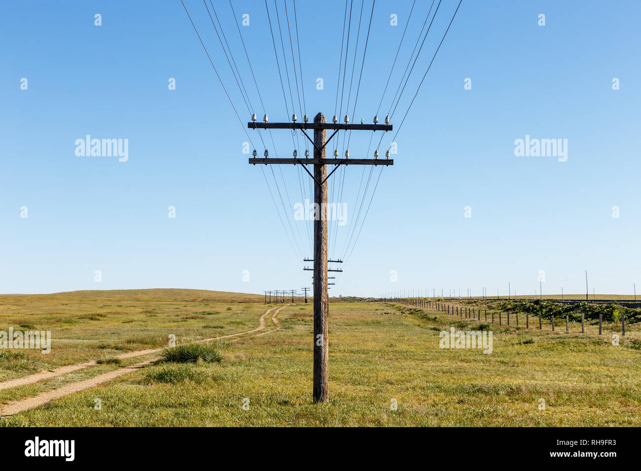 overhead line on wooden supports in the Mongolian steppe, Bayan ...