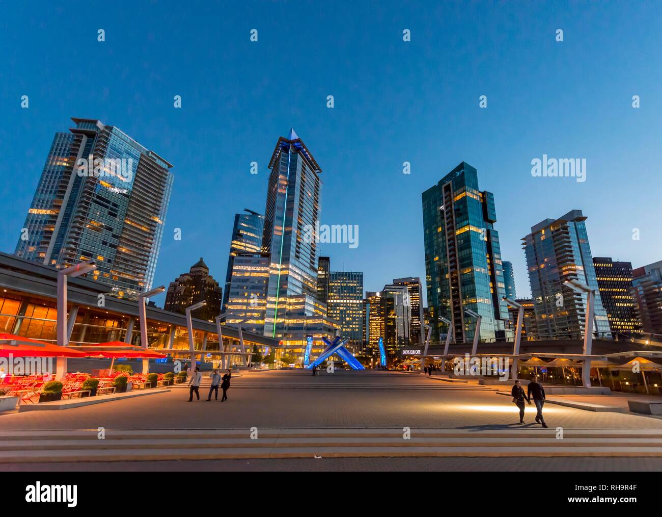 Place Jack Poole Plaza with a statue, Olympic Cauldron, skyscrapers at ...