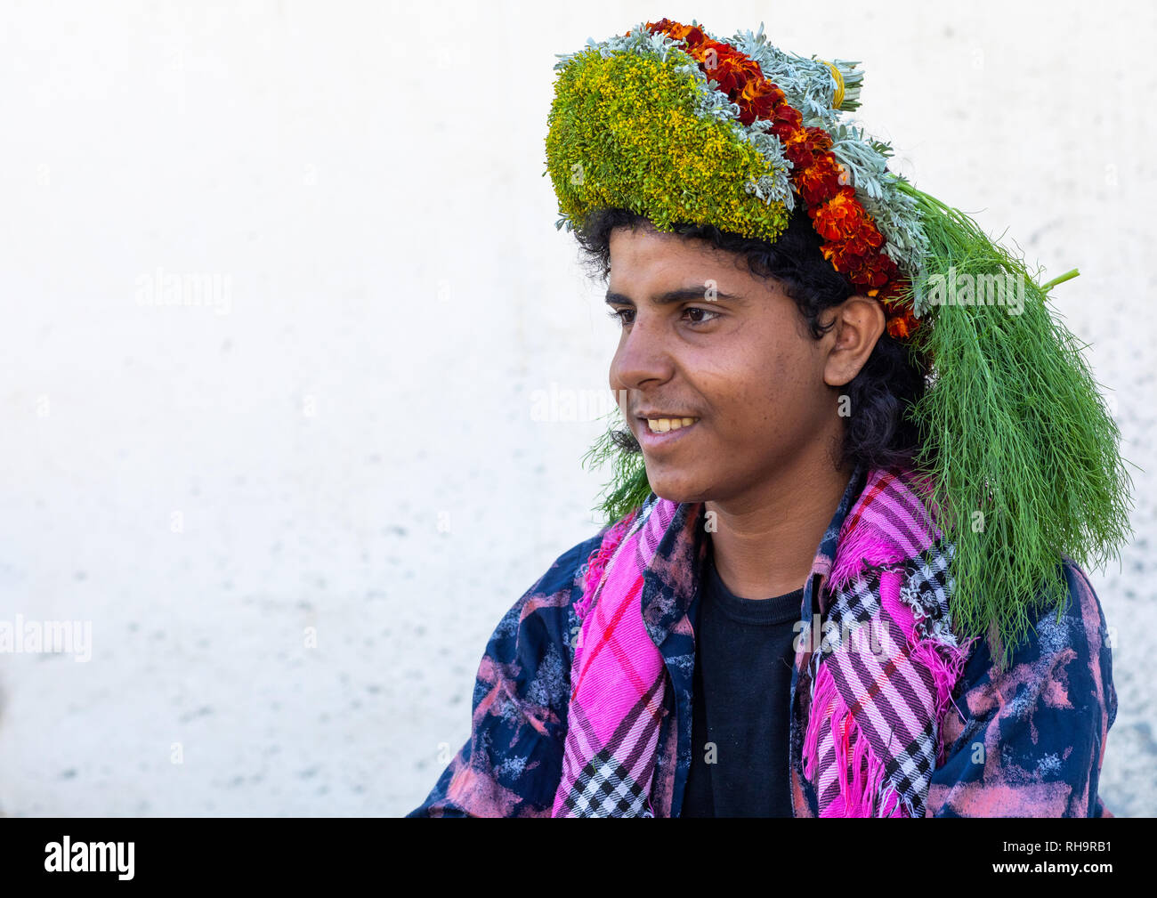 Portrait of a flower man wearing a floral crown on the head, Jizan ...