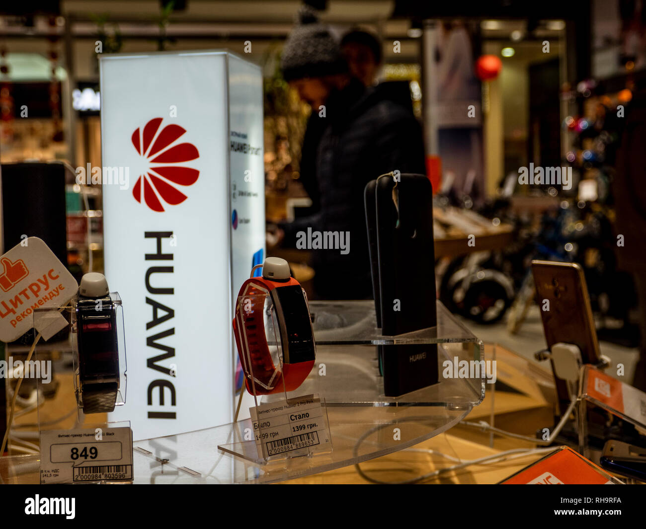 Huawei logo seen at the shelf with smartphones in the store Stock Photo ...