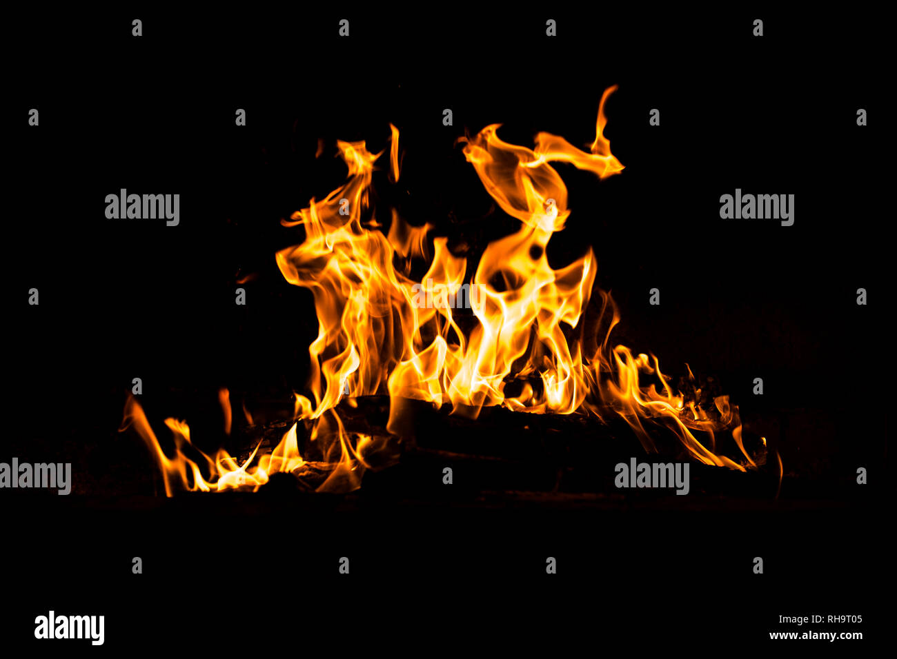 Fire flames burning isolated on black background. High resolution wood ...