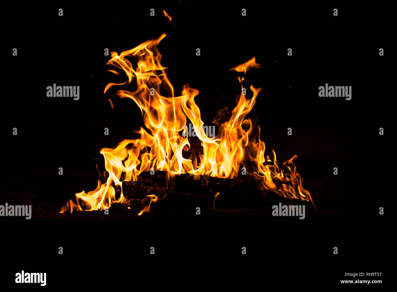 Fire flames burning isolated on black background. High resolution wood ...