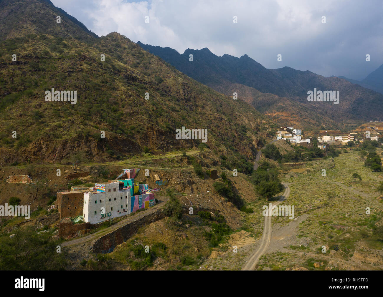 Aerial view of an old traditional house with 2030 logo on the facade ...