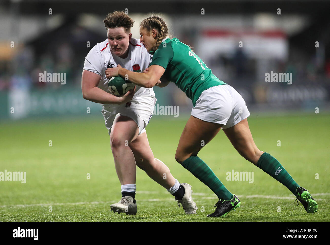 England's Hannah Botterman is tackled by Ireland's Megan Williams ...