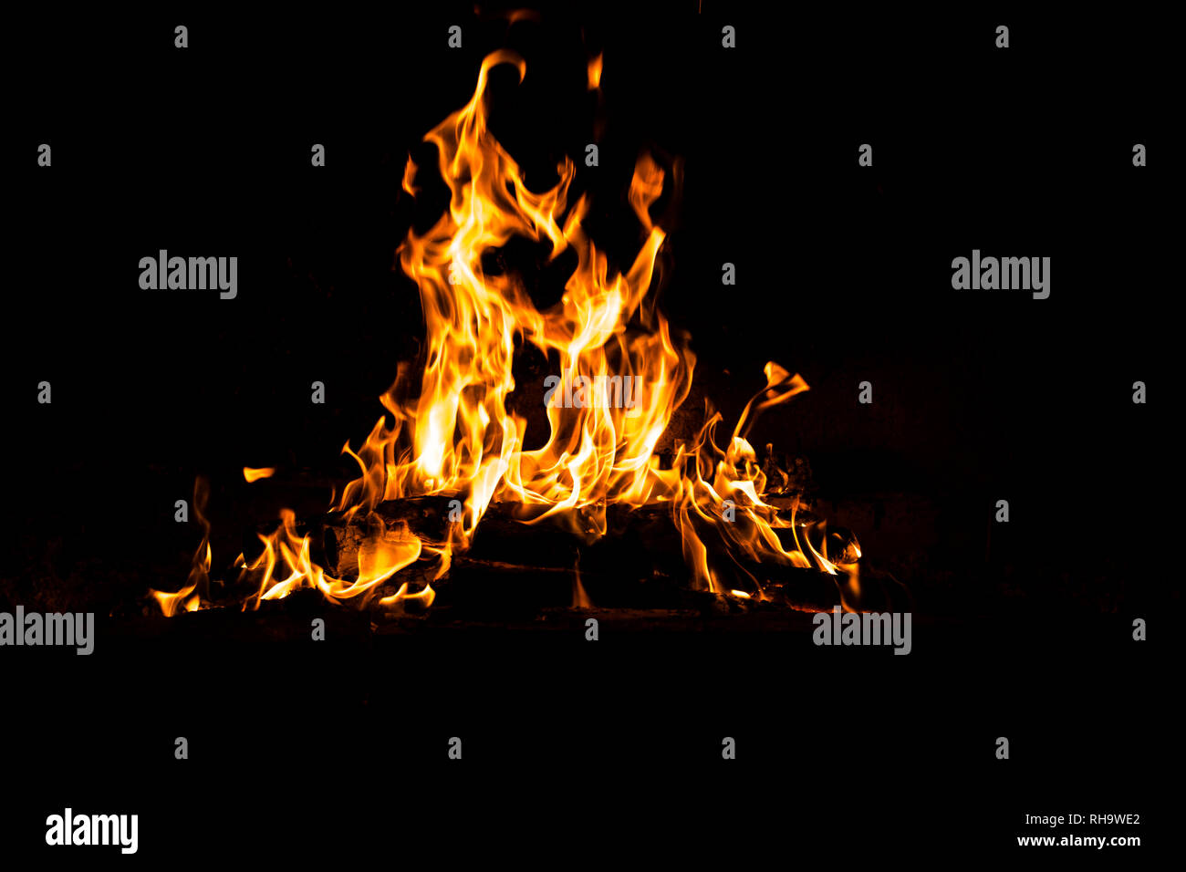 Fire flames burning isolated on black background. High resolution wood ...