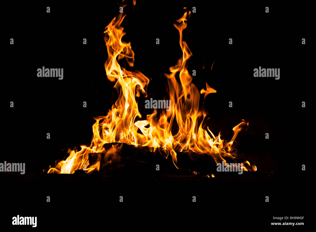 Fire flames burning isolated on black background. High resolution wood ...
