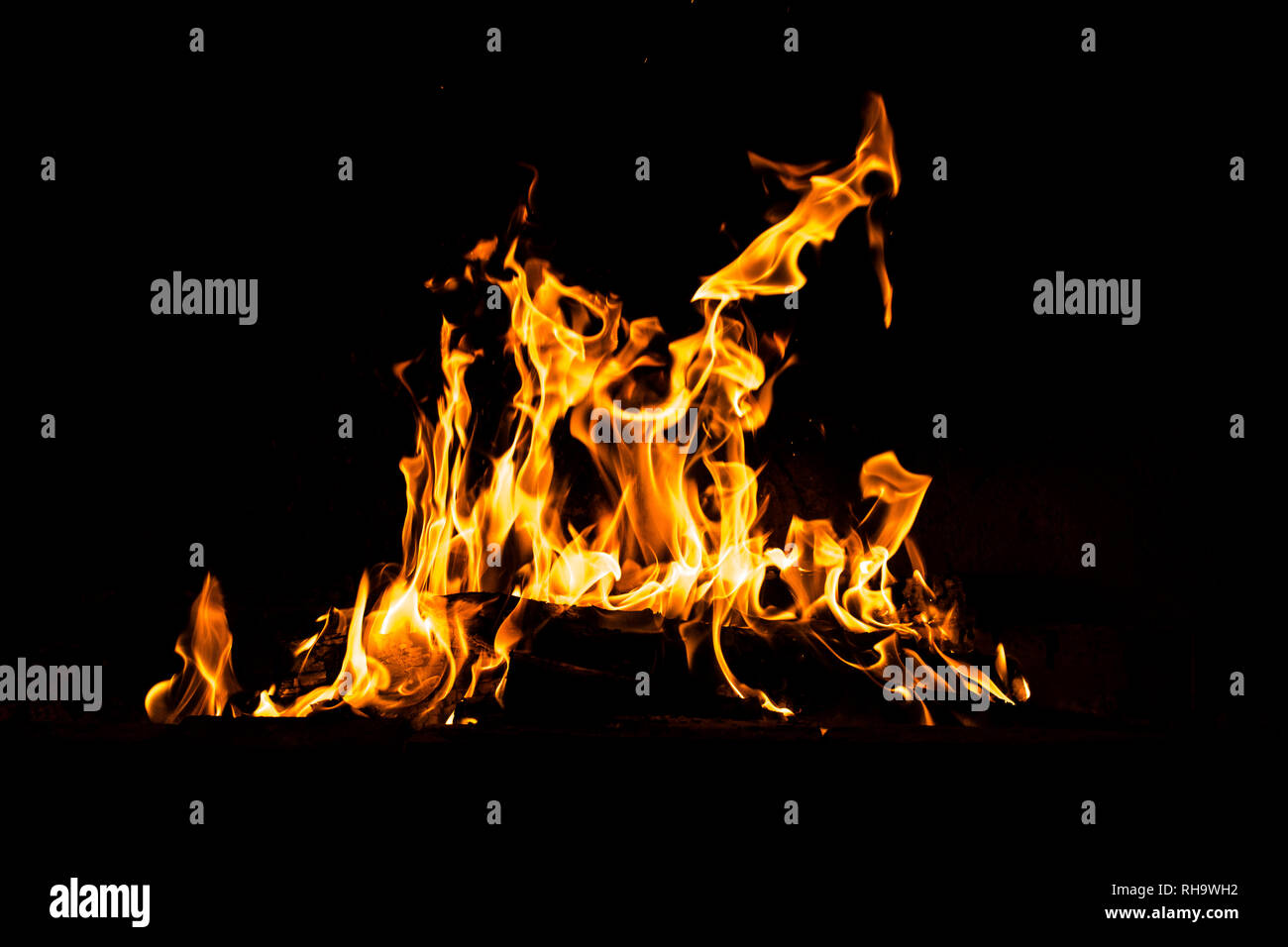 Fire flames burning isolated on black background. High resolution wood ...