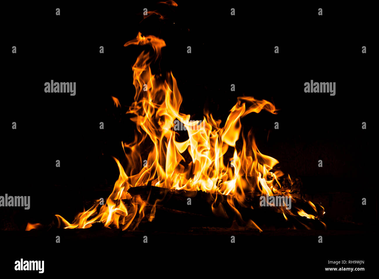 Fire flames burning isolated on black background. High resolution wood ...