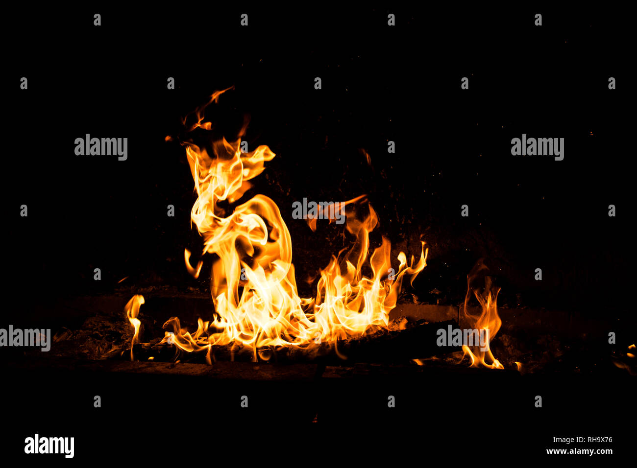 Fire flames burning isolated on black background. High resolution wood ...