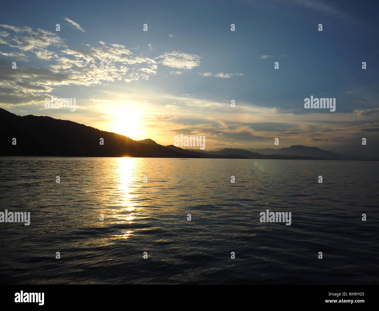 watching sunset from a boat at Paradise Cove, Haiti, Caribbeans Stock ...