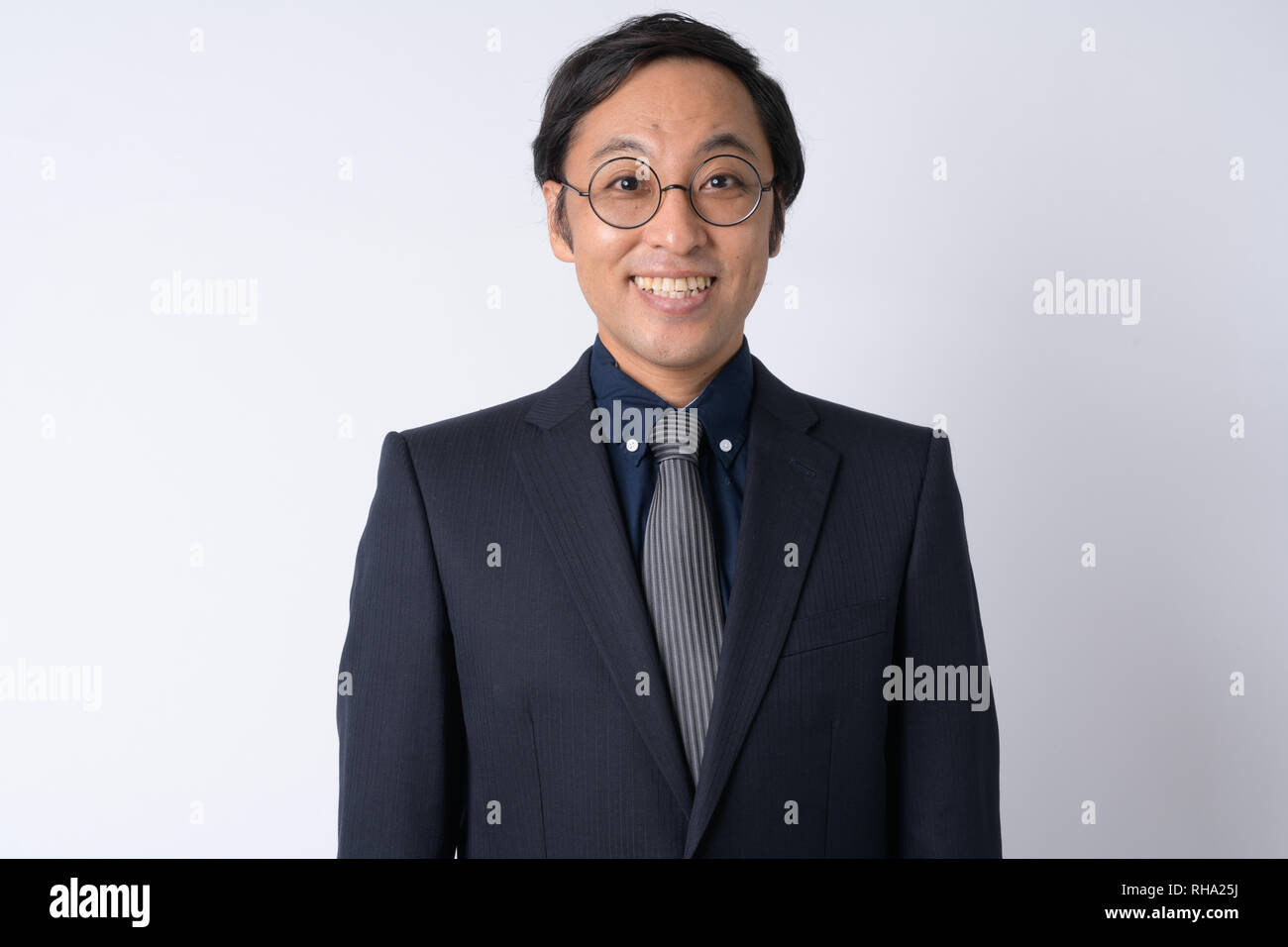 Portrait of happy Japanese businessman in suit smiling Stock Photo - Alamy