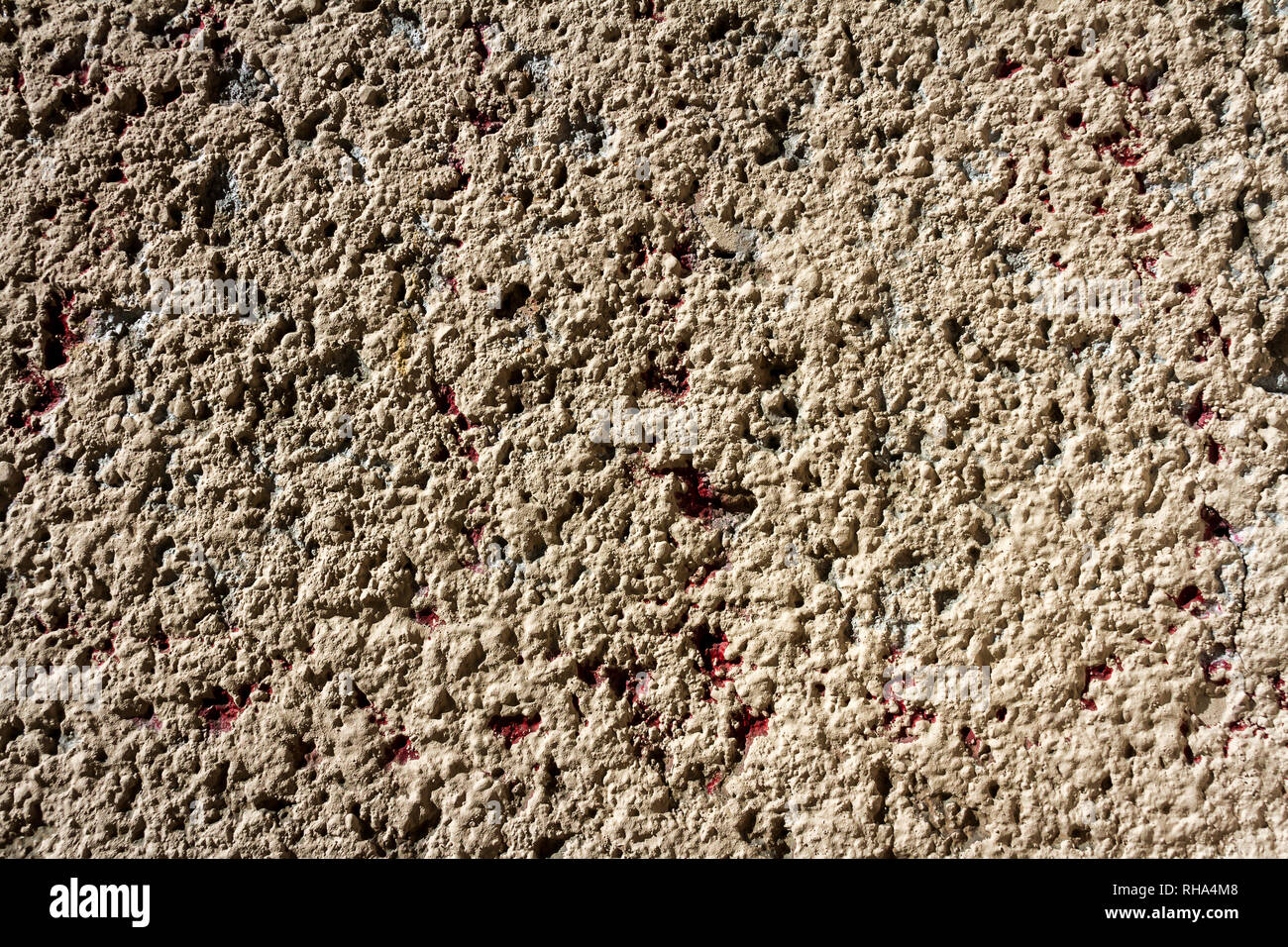 Gray and red plaster street wall texture background Stock Photo - Alamy