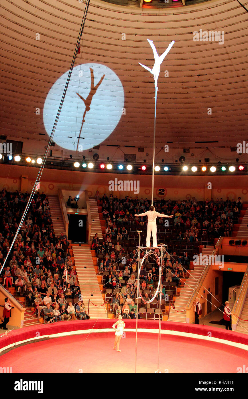 Circus number. Man equilibrist showing tricks during performance of ...