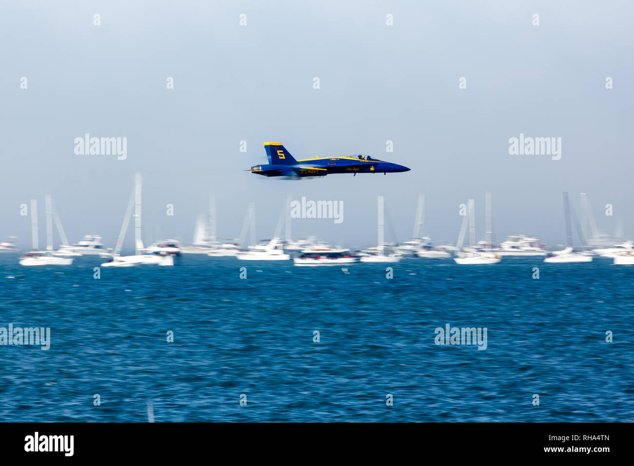 Blue angel swoops down low over beach at air show over San Francisco ...