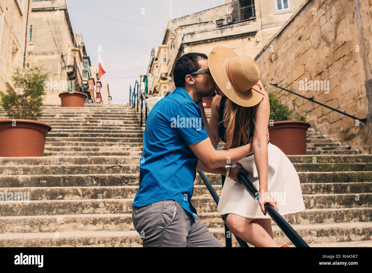 Kissing couple on stairs hi-res stock photography and images - Alamy