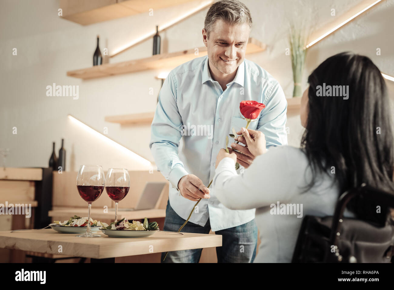 Giving a flower hi-res stock photography and images - Alamy