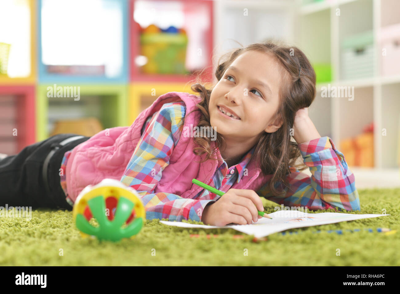 Girl lying on floor drawing hi-res stock photography and images - Alamy