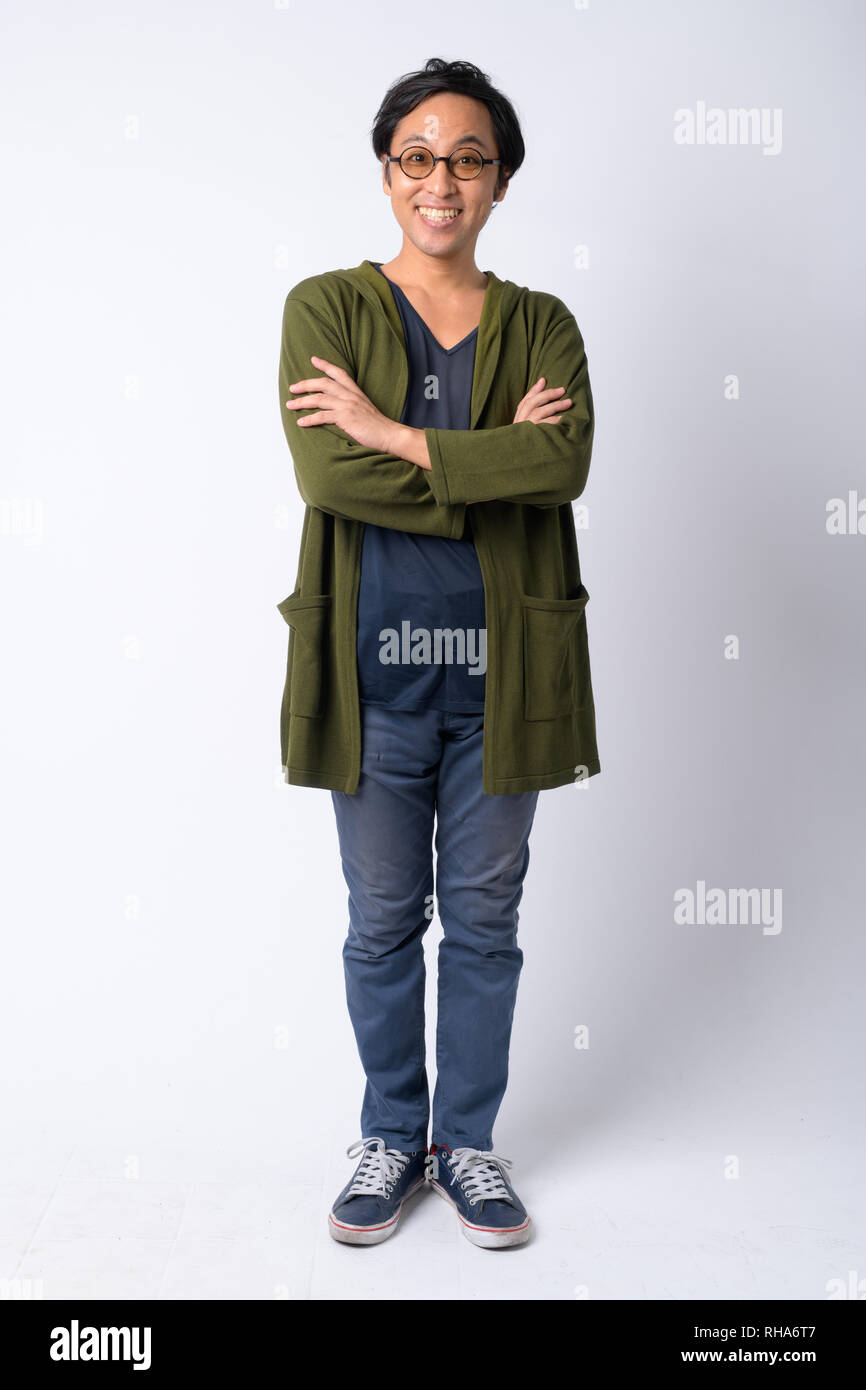Full body shot of happy Japanese man with arms crossed Stock Photo - Alamy