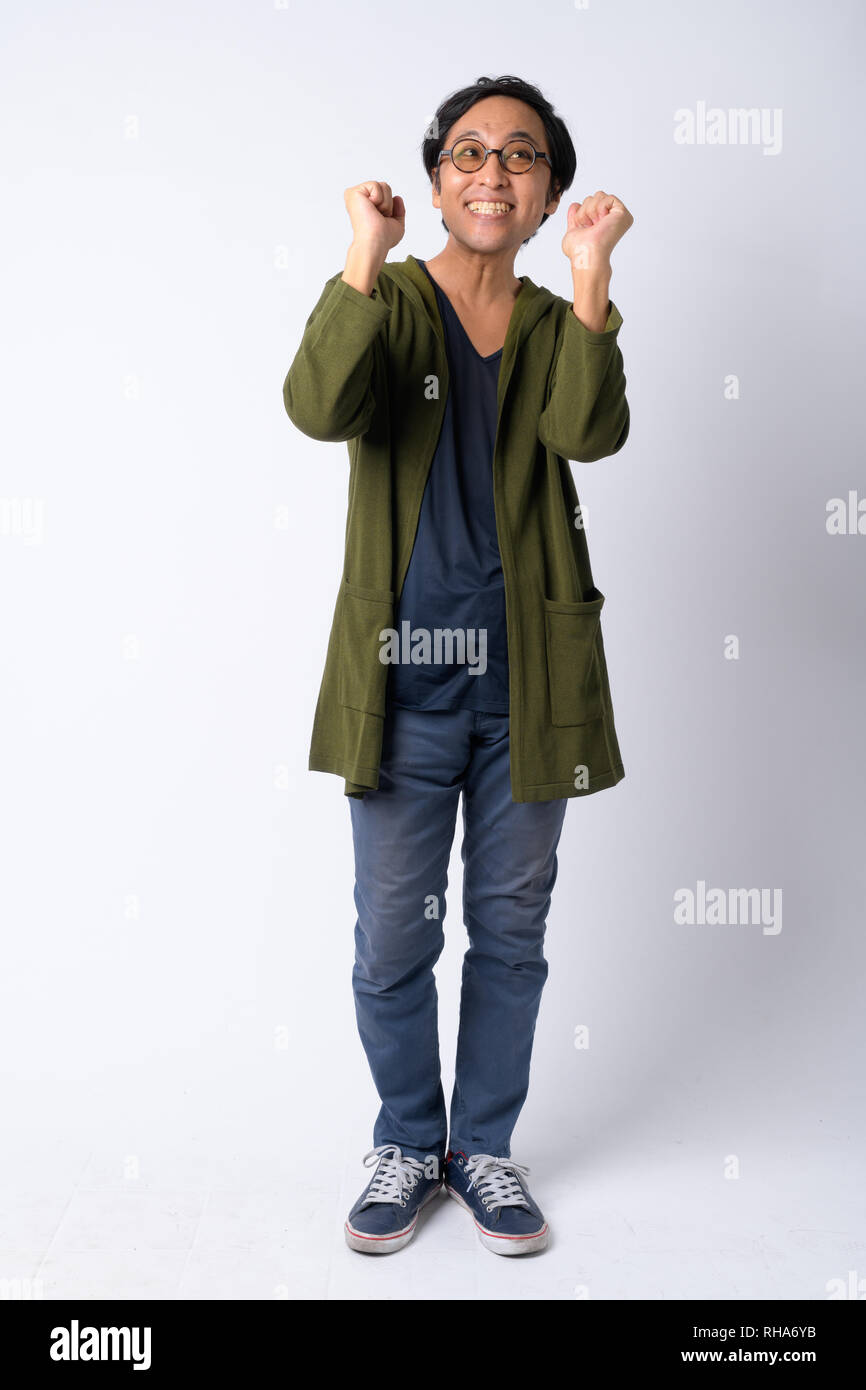 Full body shot of happy Japanese man getting good news Stock Photo - Alamy