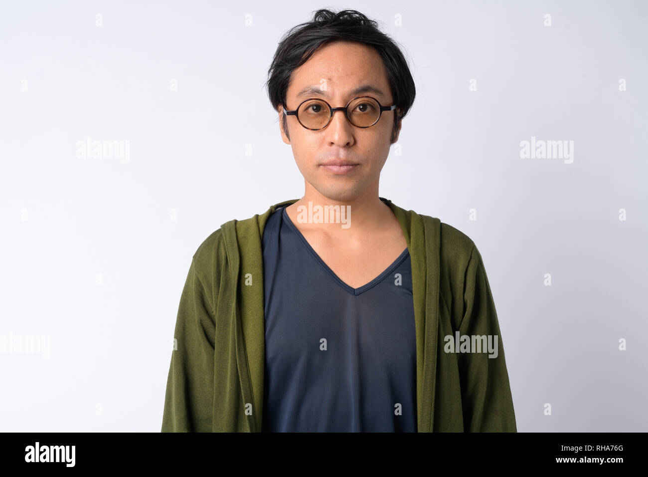 Portrait of Japanese man with eyeglasses against white background Stock ...