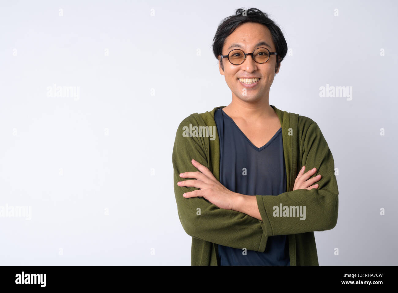 Portrait of happy Japanese man with arms crossed Stock Photo - Alamy