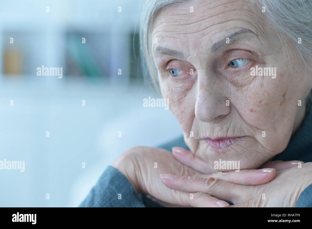 Portrait of tired senior woman posing at home Stock Photo - Alamy