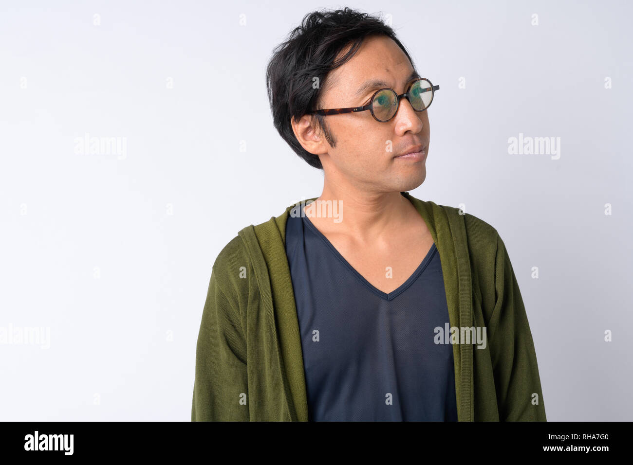 Portrait of Japanese man thinking against white background Stock Photo ...