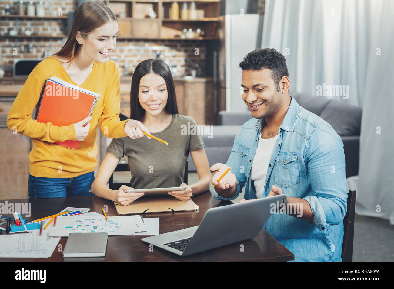 Vigorous three students getting ready for exams Stock Photo - Alamy