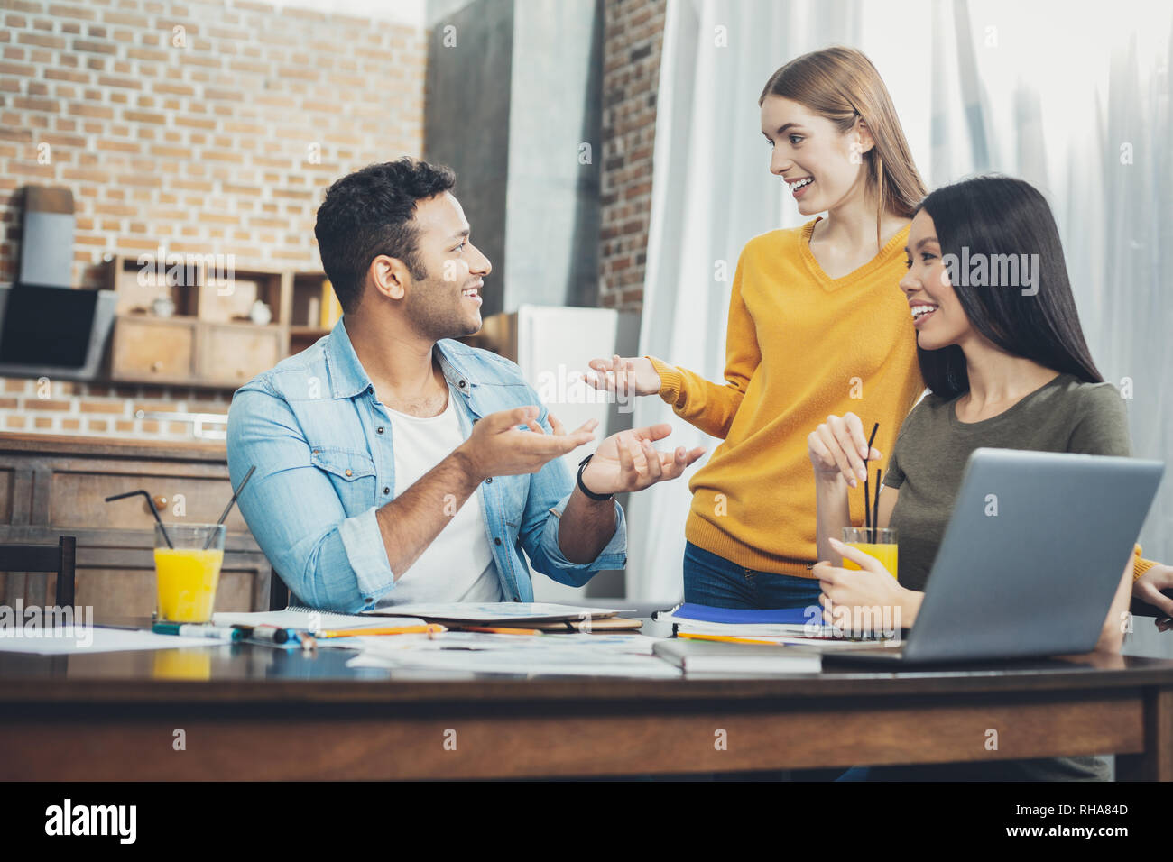Successful three colleagues marking startup Stock Photo - Alamy