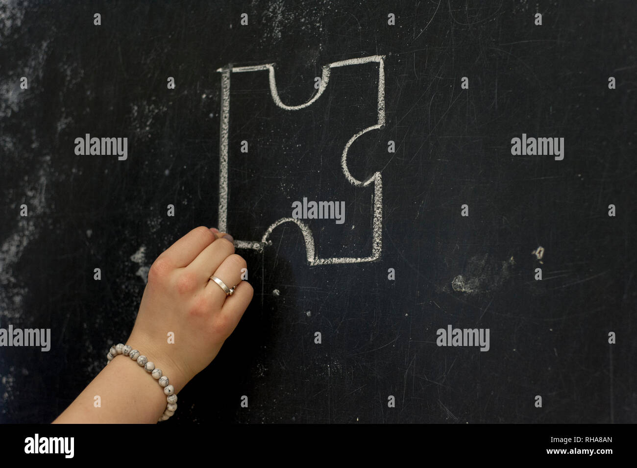 Chalk hand drawing as puzzle shape on black board background Stock ...
