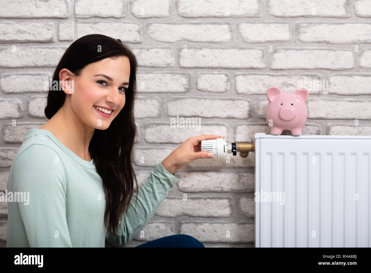 Woman sitting on radiator hi-res stock photography and images - Alamy