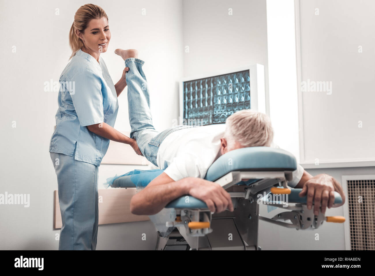Chiropractor checking spine hi-res stock photography and images - Alamy
