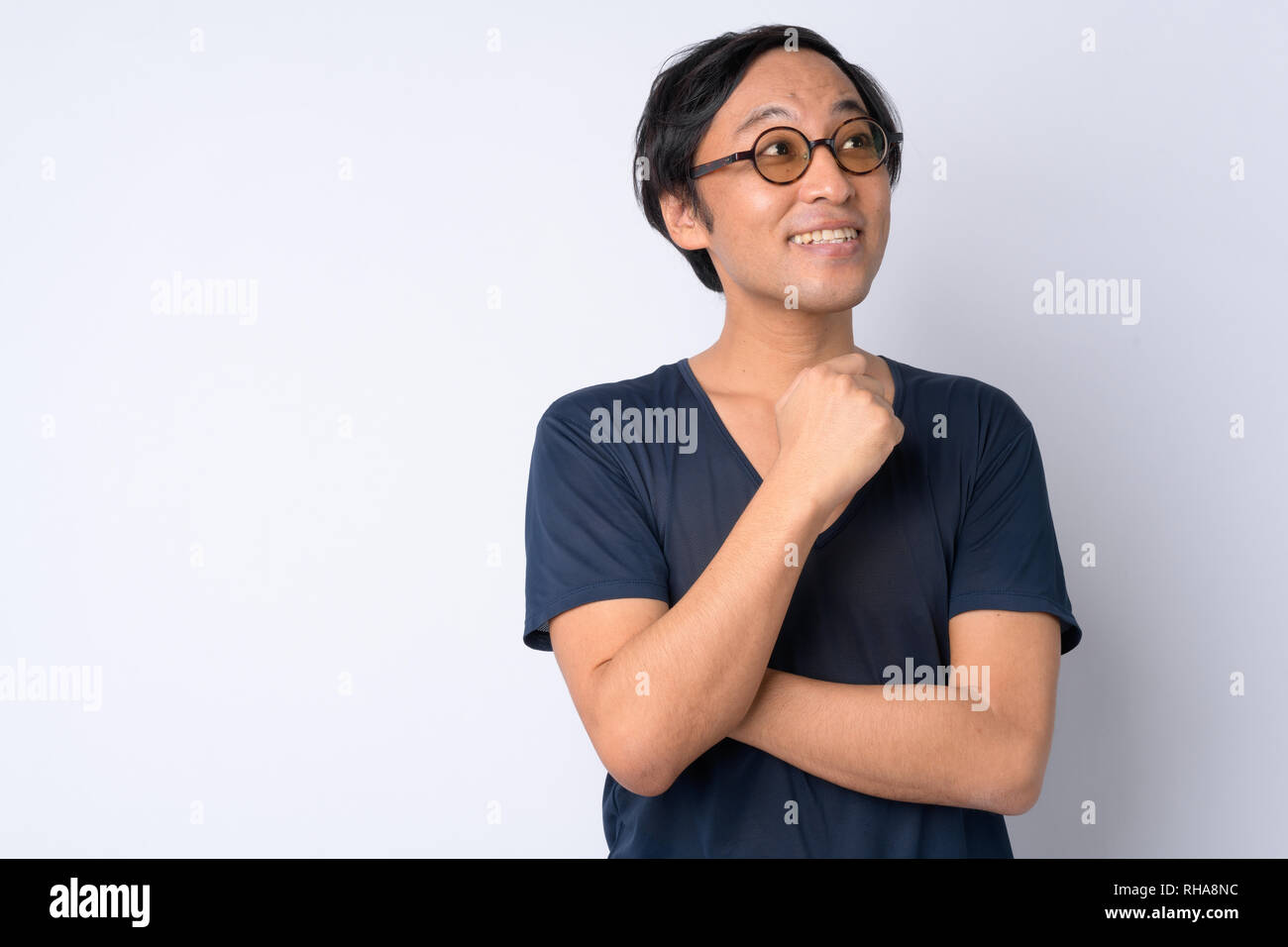 Portrait of happy Japanese man smiling and thinking Stock Photo - Alamy