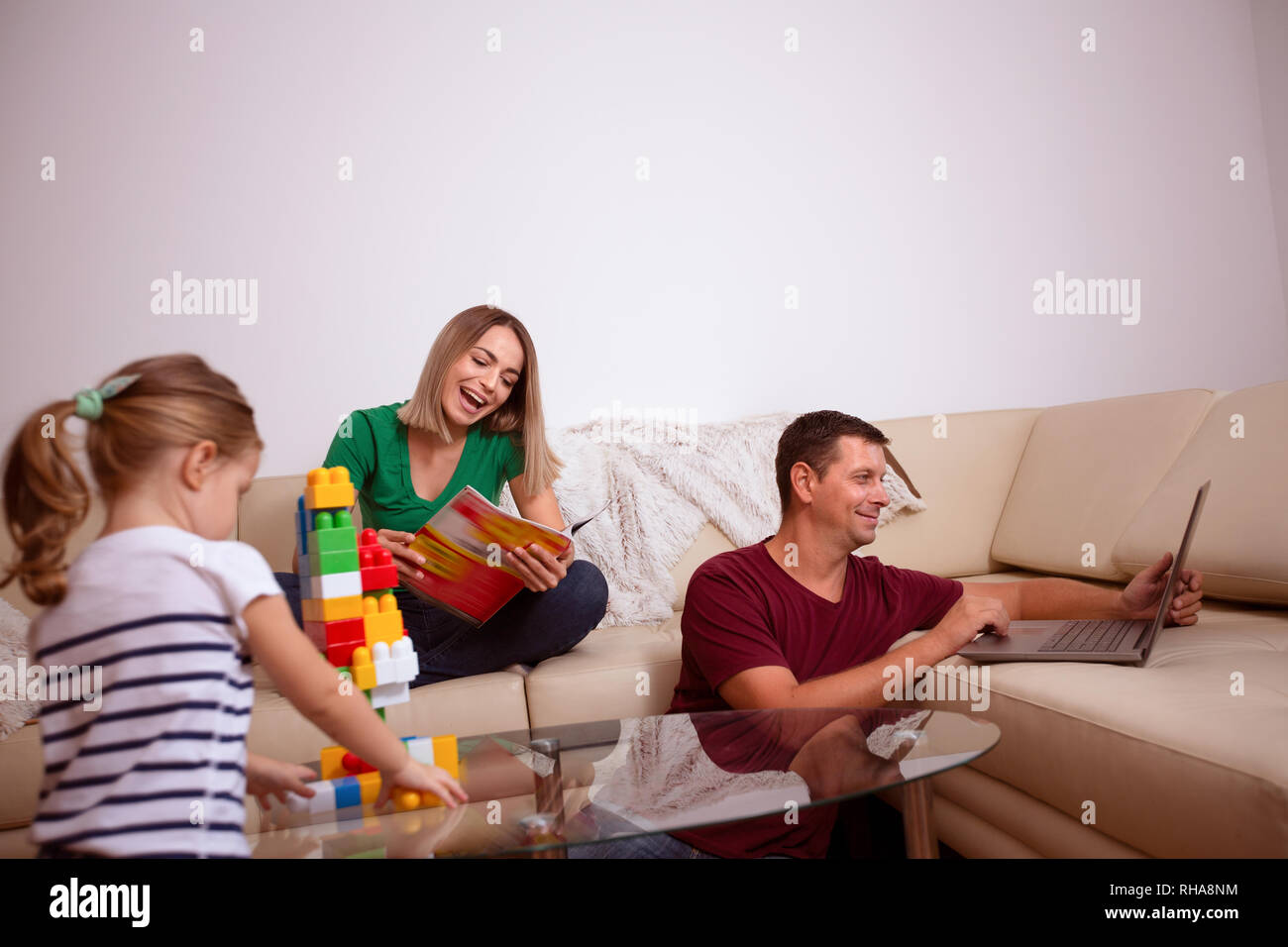 Family having fun at home together Stock Photo - Alamy