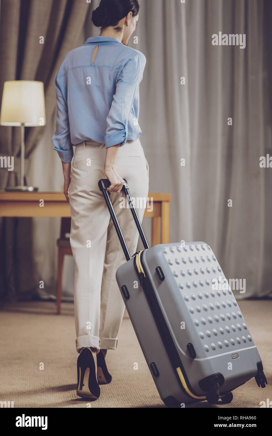 Woman leave suitcase hi-res stock photography and images - Alamy