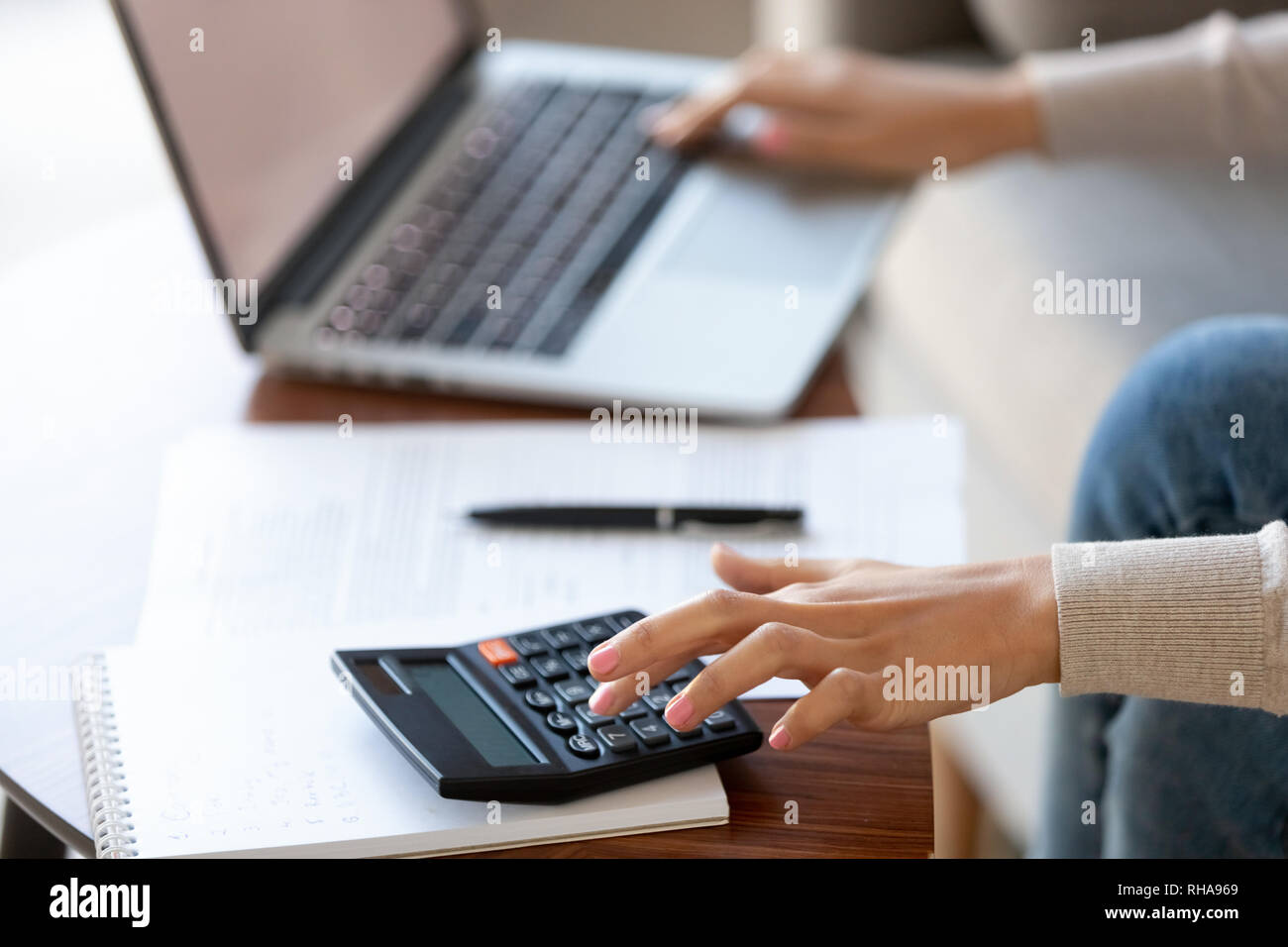 Calculator laptop hands paper business hi-res stock photography and ...