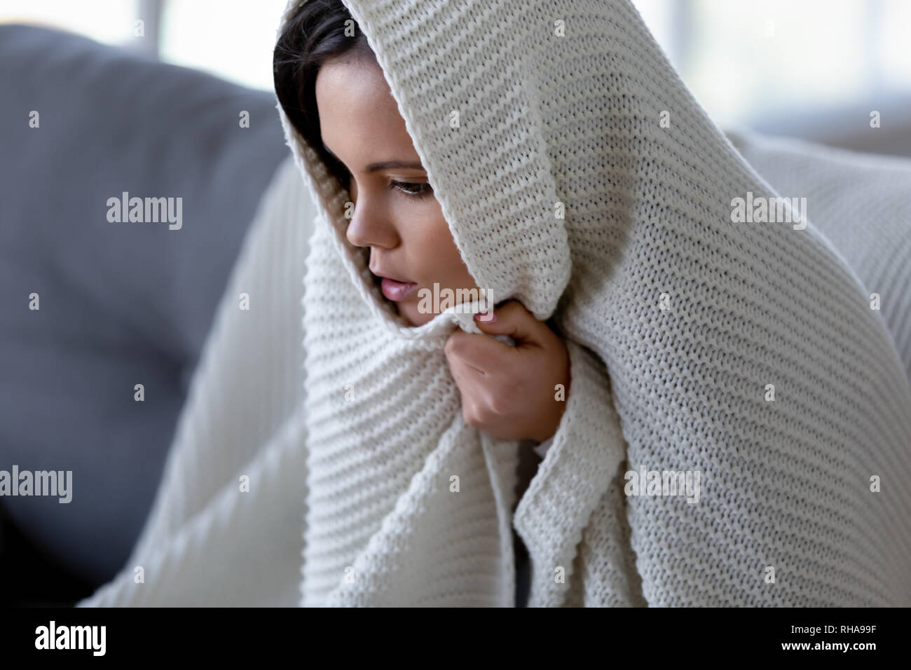 Ill woman feeling cold having flu symptoms covered with blanket Stock ...