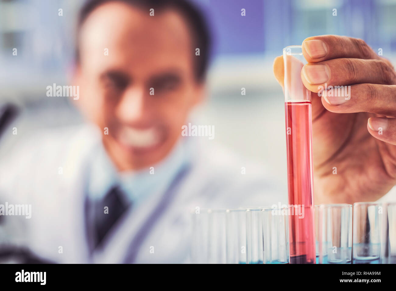 Happy researcher holding important test tube for discovery Stock Photo ...
