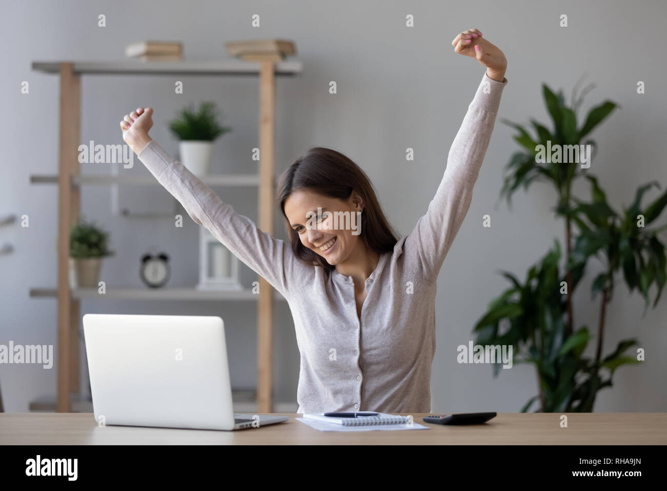 Happy successful teen girl student finished study looking at laptop ...