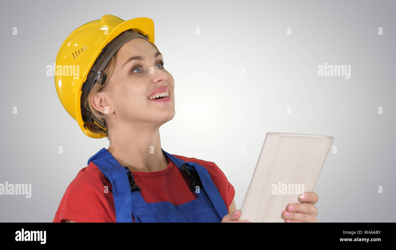 Female construction engineer with a tablet computer at a construction ...