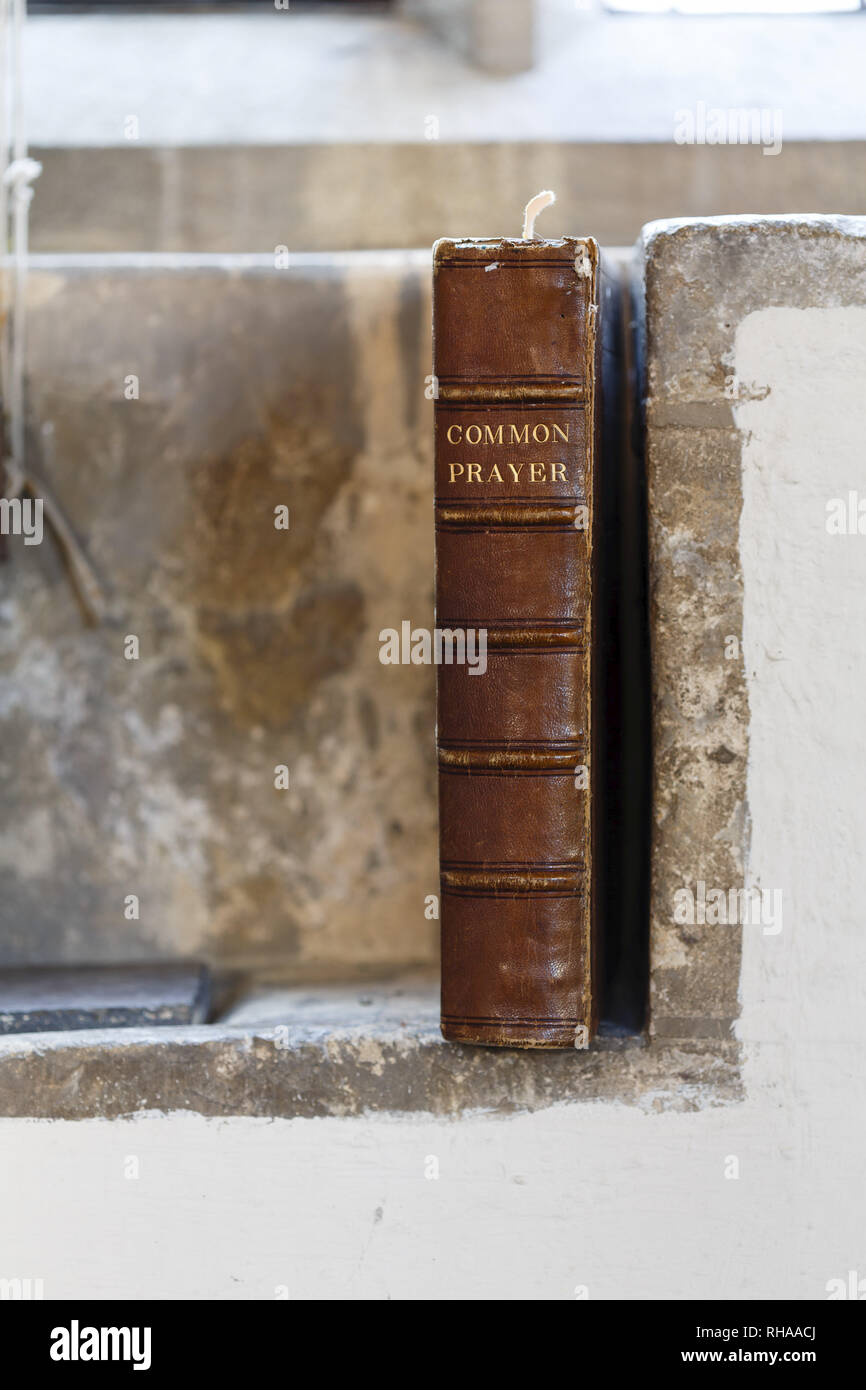 Ancient prayer book in an old church. Depicts praying and christianity ...