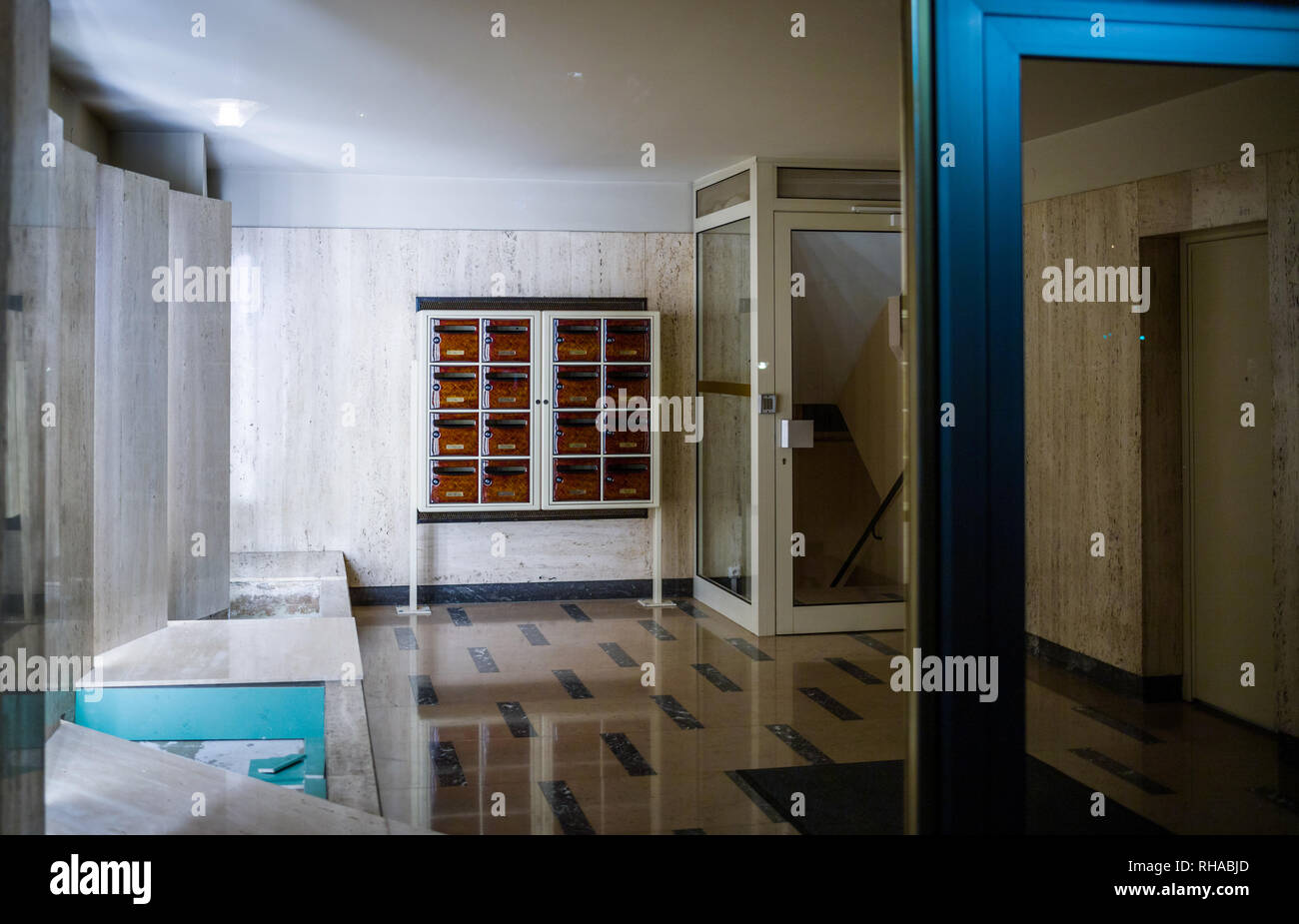 Night scene Entrance to modern vintage apartment building foyer lobby ...