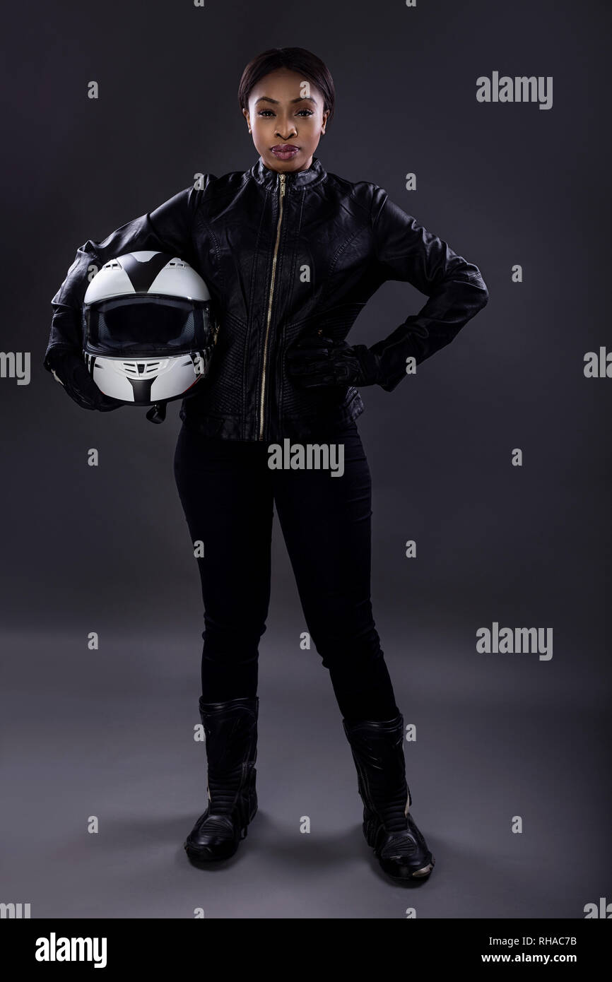 Black female motorcycle biker or race car driver or stuntwoman wearing ...