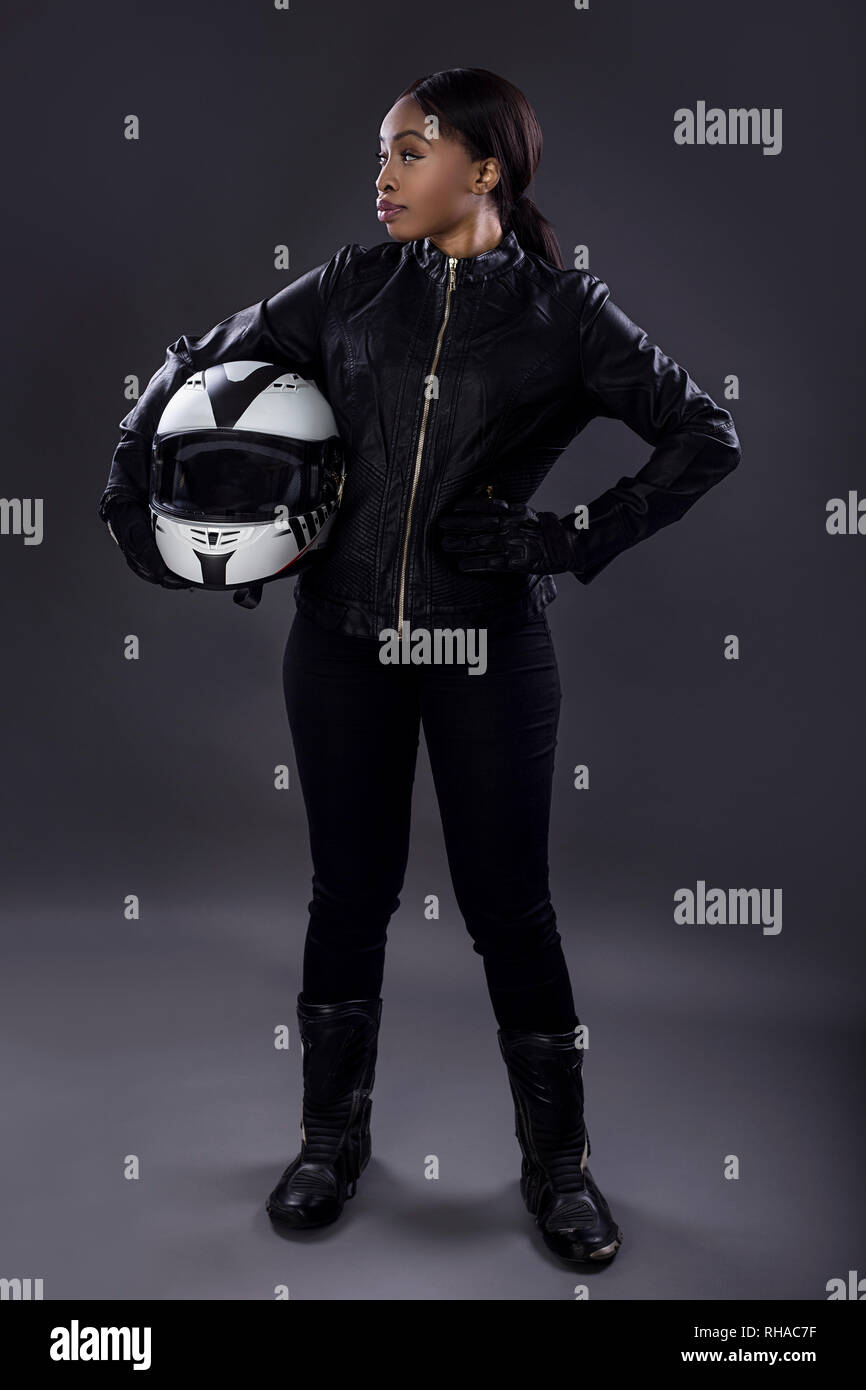 Black female motorcycle biker or race car driver or stuntwoman wearing ...
