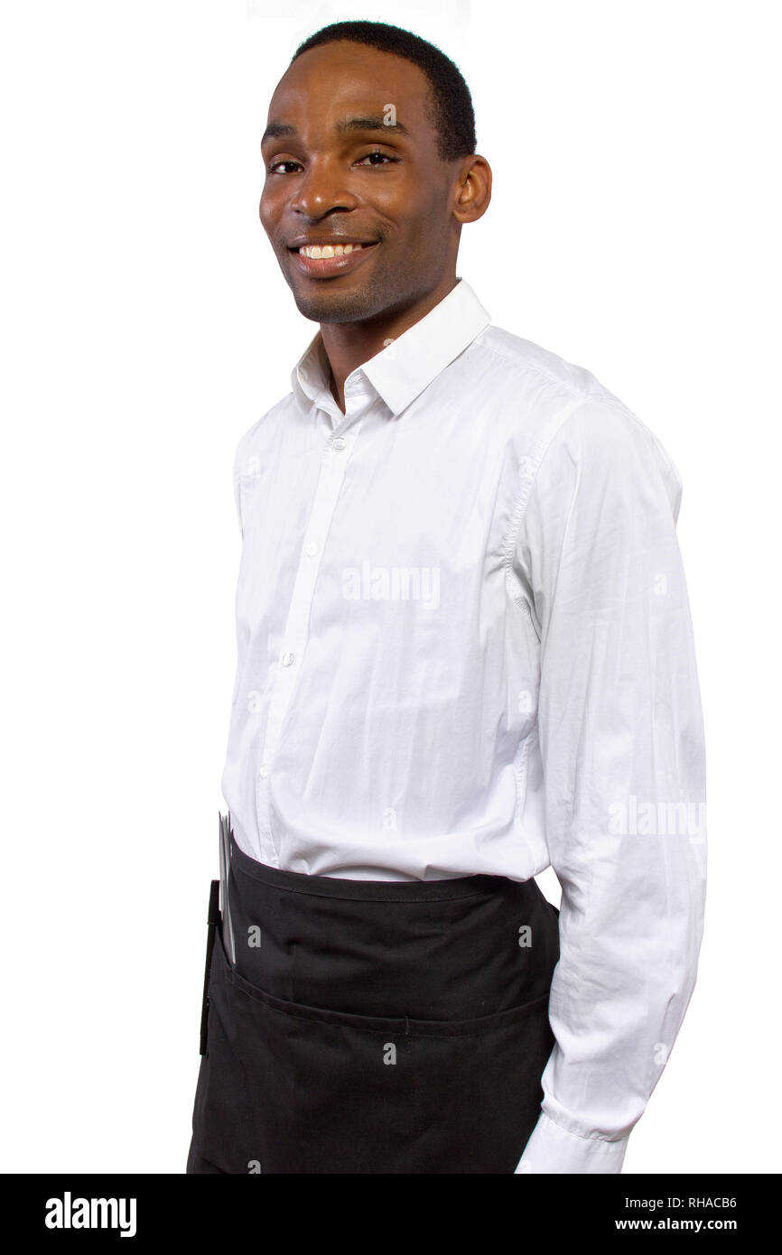 young African-American waiter wearing an apron on white background ...